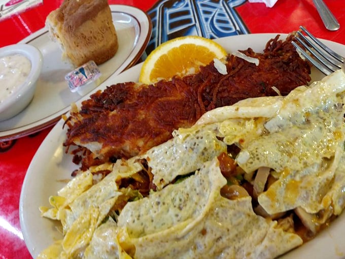 An omelet so stuffed with goodness it needs its own zip code, accompanied by hash browns that achieve the perfect crisp-to-tender ratio.