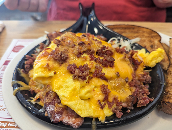 The bacon skillet arrives sizzling with promise&mdash;a mountain of breakfast goodness that demands both a fork and respect.