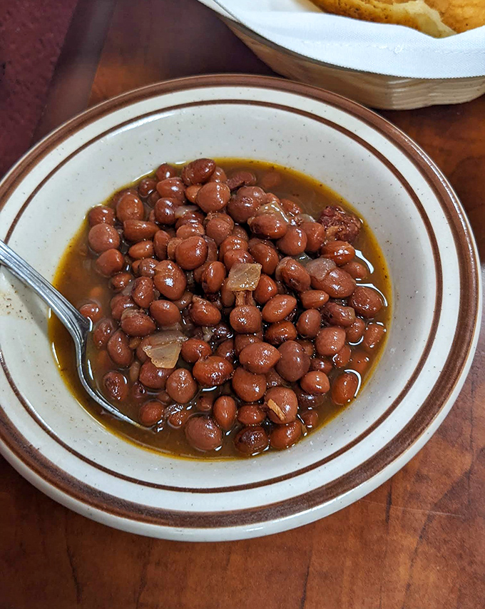 These aren't just beans; they're the supporting actor that steals the show. Slow-simmered to perfection, they've converted more vegetarians than you'd imagine.