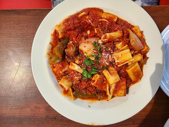 Rigatoni swimming in a sea of savory sauce. The kind of pasta dish that makes you want to book a flight to Naples immediately.