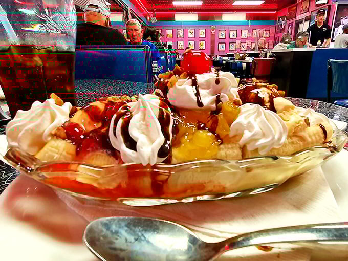 This magnificent banana split is a towering symphony of ice cream, toppings, and whipped cream—a true diner masterpiece!