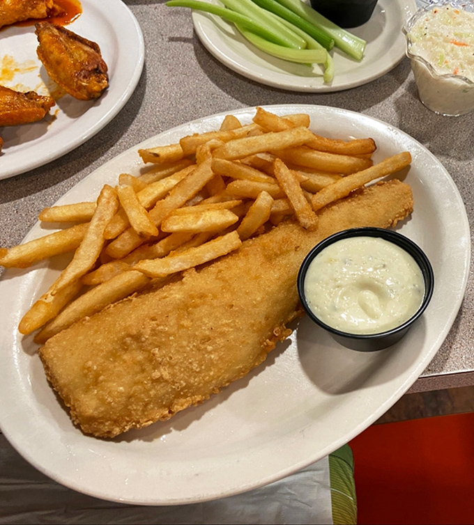 Golden-battered cod that's crispy on the outside, flaky on the inside – the fish that launched a thousand "just one more bite" promises.