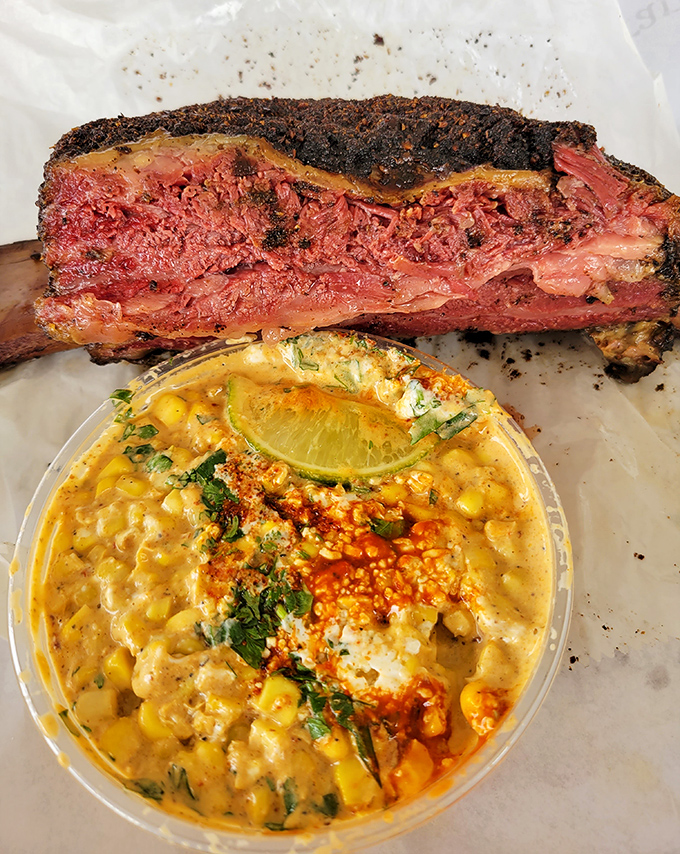 The beef rib arrives like a prehistoric trophy, impossibly pink and tender beneath its peppery crust. Flintstone-sized satisfaction guaranteed.