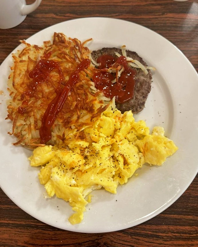A breakfast plate that hits all the right notes: savory eggs, hearty meat, and those hash browns that deserve their own fan club.