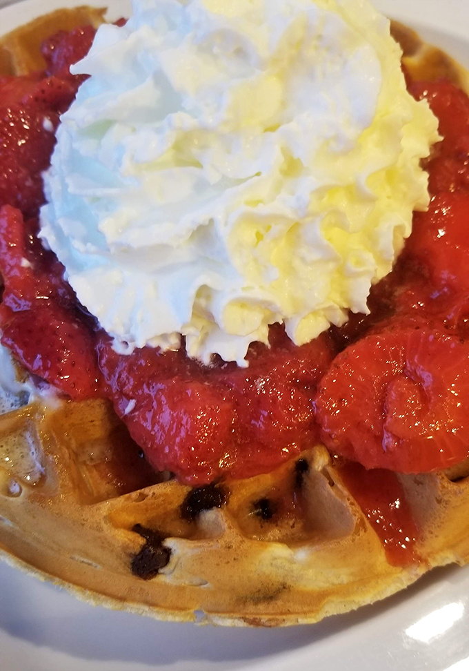 Strawberry waffle perfection! The crisp edges, the sweet berries, that cloud of whipped cream&mdash;breakfast that thinks it's dessert, and we're not complaining.