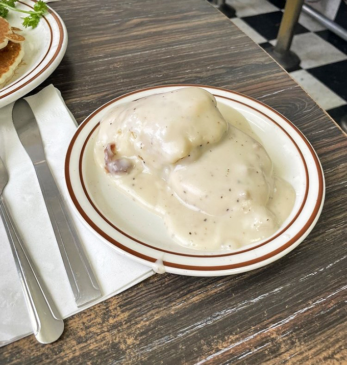 Biscuits and gravy: the breakfast that hugs you from the inside. This plate doesn't just feed you&mdash;it adopts you.