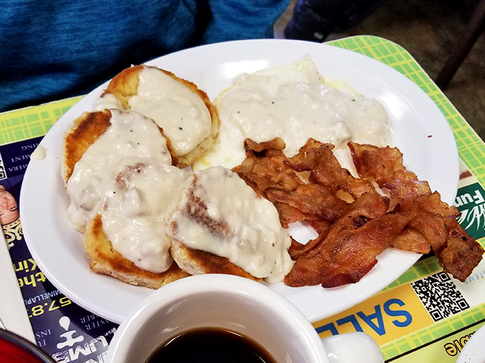 Biscuits and gravy: Southern comfort meets Pittsburgh practicality. That bacon on the side isn't just a garnish &ndash; it's an exclamation point to a perfect morning statement. 