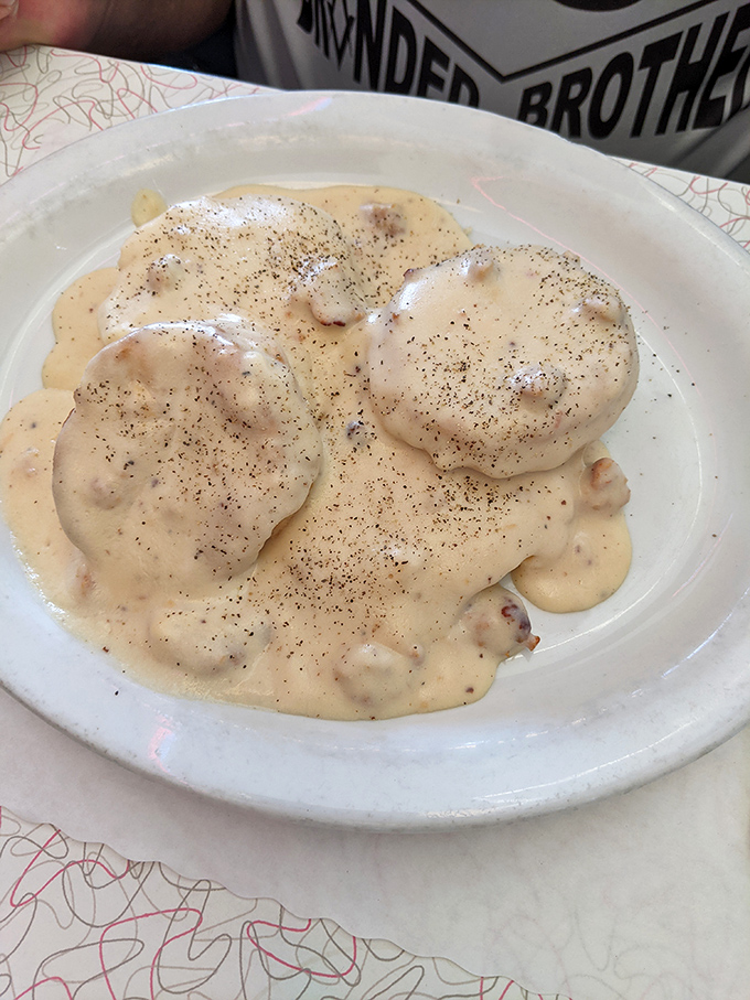 Biscuits swimming in creamy, pepper-flecked gravy—a breakfast so good it should be illegal before noon. Pure Wyoming comfort.