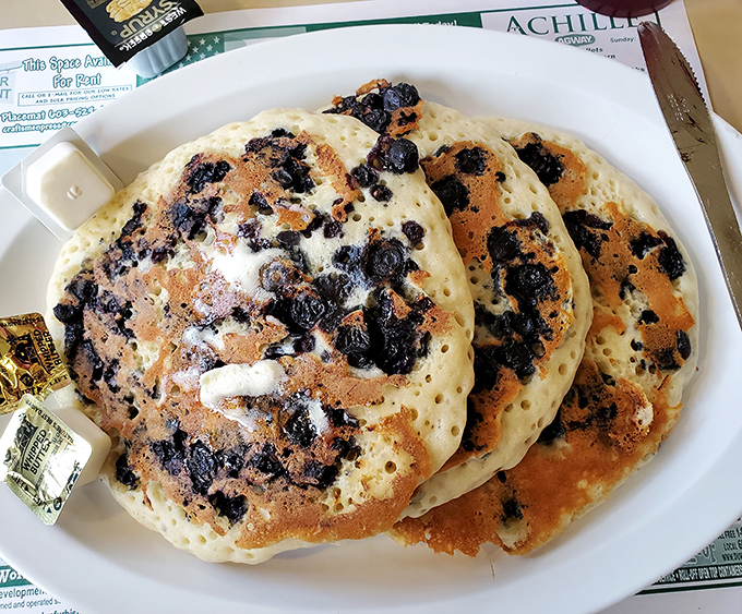 Blueberry pancakes that make you understand why people write songs about breakfast – each berry a tiny burst of summer.