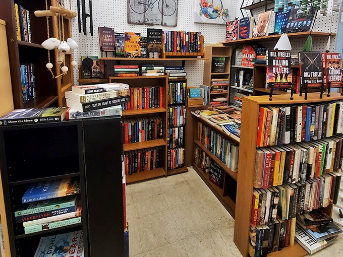 A bibliophile's dream corner where mystery novels stack up like alibis. I spot at least three books I'd stay up too late reading.