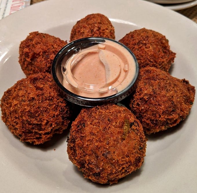 Crispy boudin balls arranged like edible works of art, just waiting to introduce you to Louisiana's most addictive appetizer tradition.
