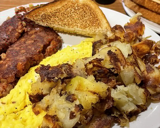 Breakfast done right &ndash; crispy hash browns mingling with eggs and toast like old friends at a reunion.