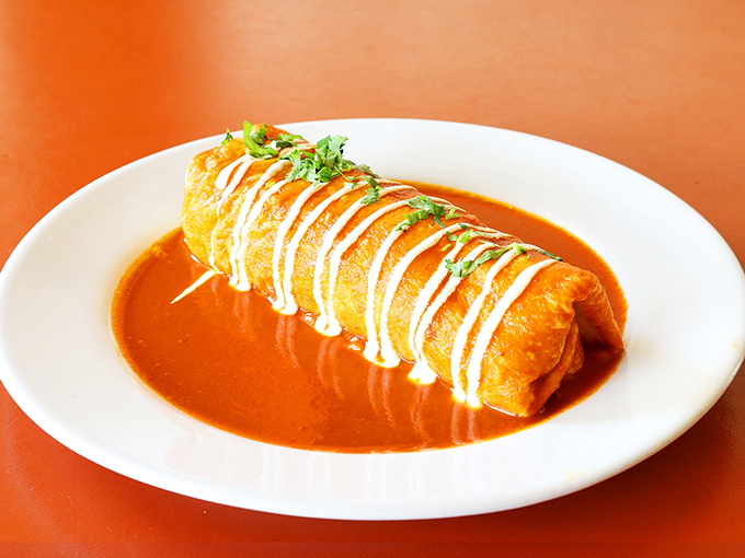 This breakfast burrito, smothered in sauce and drizzled with crema, is what your morning commute has been missing all along.