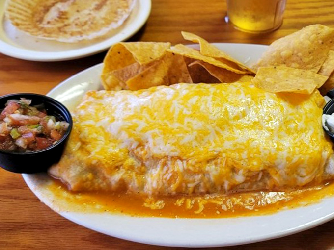 This breakfast burrito, blanketed in melted cheese and served with fresh pico de gallo, is the morning equivalent of a warm hug.