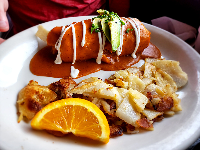 This breakfast enchilada topped with fresh pico and sour cream is what happens when breakfast and lunch stop fighting and fall in love.