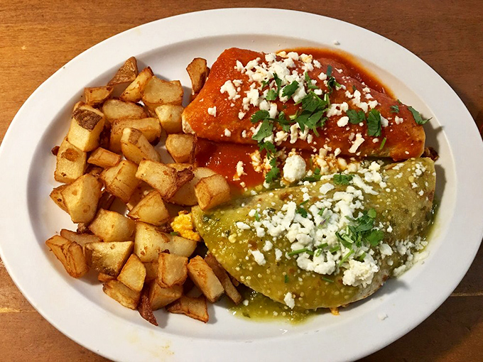 Breakfast enchiladas that make you question why you ever settled for cereal—smothered in sauce and crowned with queso fresco.