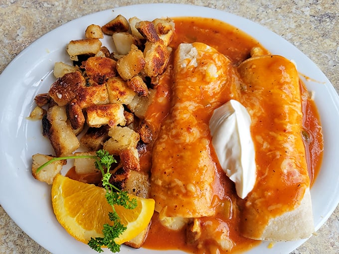 These enchiladas aren't just breakfast, they're an event. Smothered in sauce and topped with a dollop of sour cream – morning salvation on a white plate.
