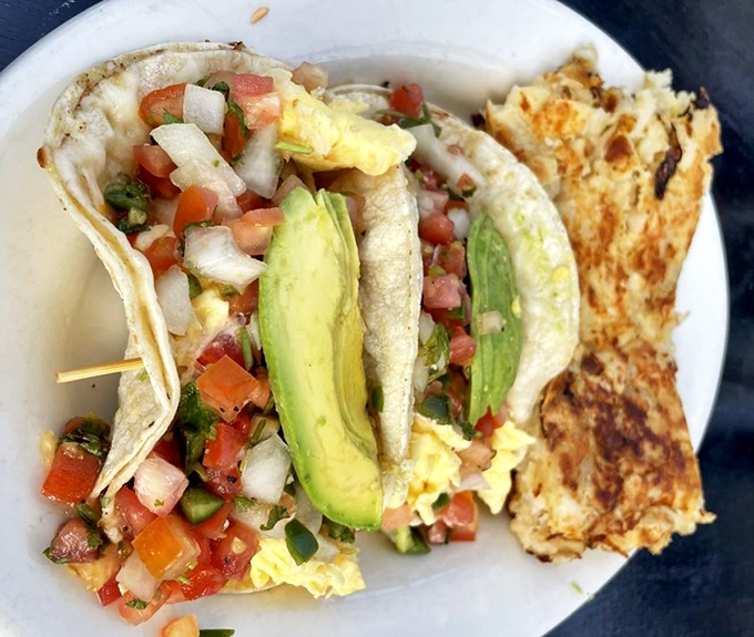 Breakfast tacos that bring a fiesta to your morning – fresh pico de gallo, creamy avocado, and fluffy eggs create a handheld celebration.