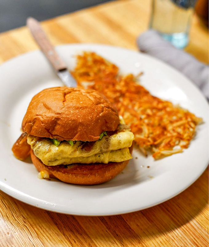 Breakfast sandwiches should all aspire to this level of perfection: fluffy eggs nestled in a golden brioche bun with crispy hash browns standing guard.