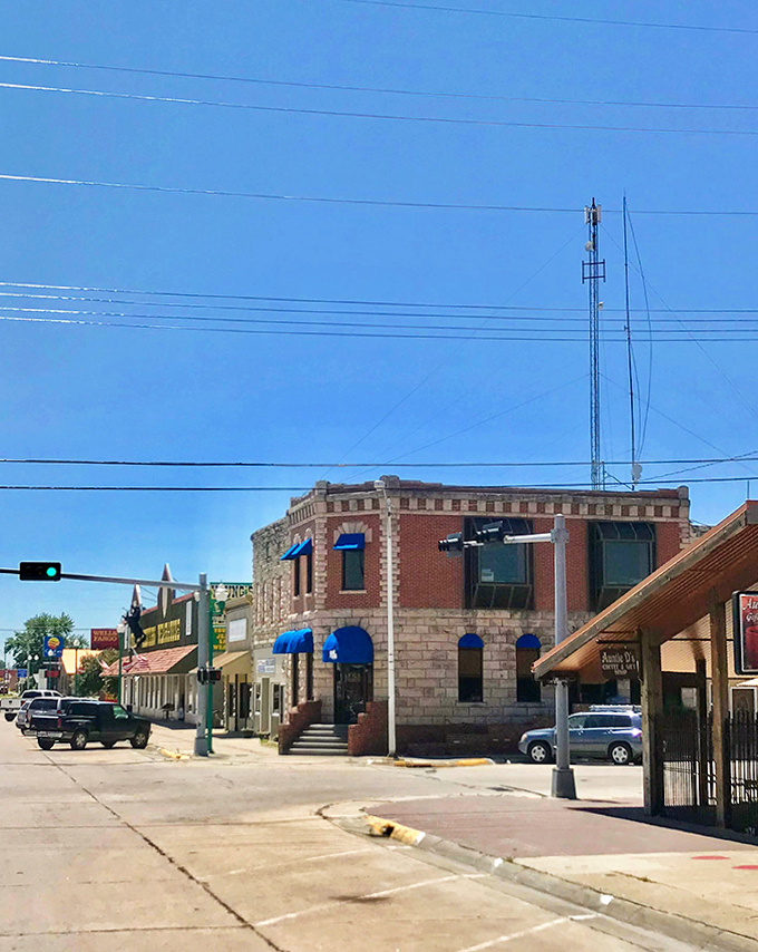That corner building with blue awnings has probably witnessed more Valentine history than any local historian could recount over coffee.