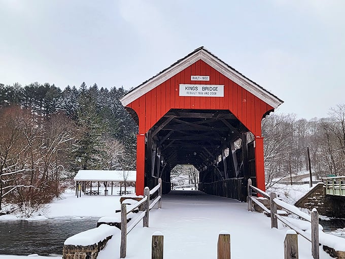 Winter transforms King's Bridge into a scene straight from a holiday card&mdash;the red exterior popping against pristine snow like nature's perfect contrast.