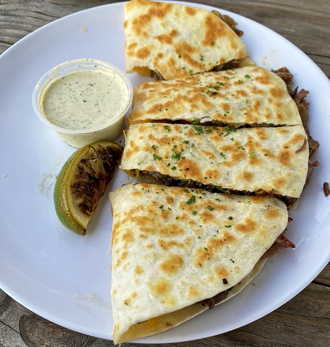 Quesadillas reimagined through the lens of barbecue brilliance. Cheese and smoked meat&mdash;a marriage made in culinary heaven.
