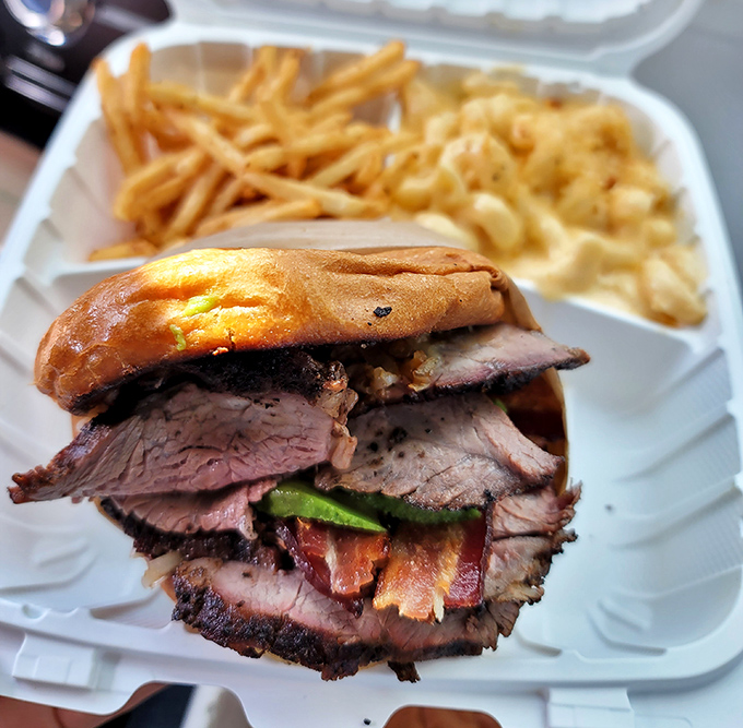 The cross-section of this sandwich reveals the truth: perfectly smoked tri-tip, stacked with architectural precision. This isn't lunch&mdash;it's edible engineering.