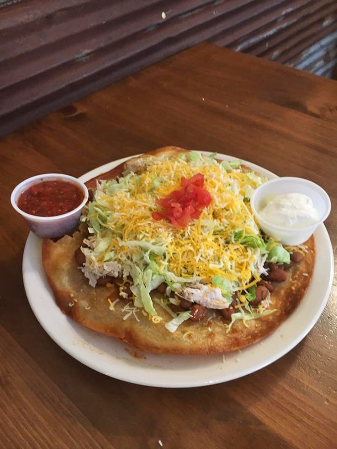 The Indian Taco arrives like a colorful festival on a plate, with layers of flavors that dance together in perfect harmony.