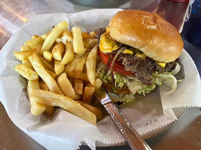 This isn't just a burger&mdash;it's architectural perfection between buns, with fries standing at attention like golden soldiers.