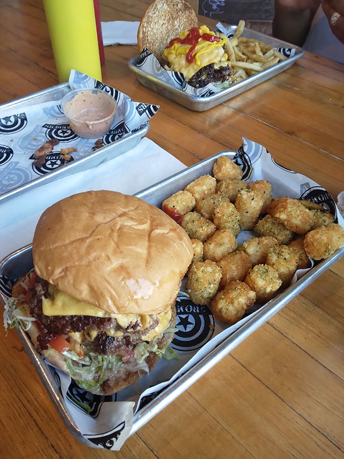 When a burger is served on a metal tray, you know it means business. The melted cheese cascades like a yellow waterfall of joy.