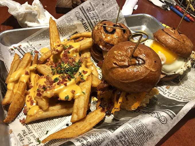 Newspaper-lined trays aren't just nostalgic&mdash;they're practical for catching every delicious morsel of these loaded cheese fries and sliders.