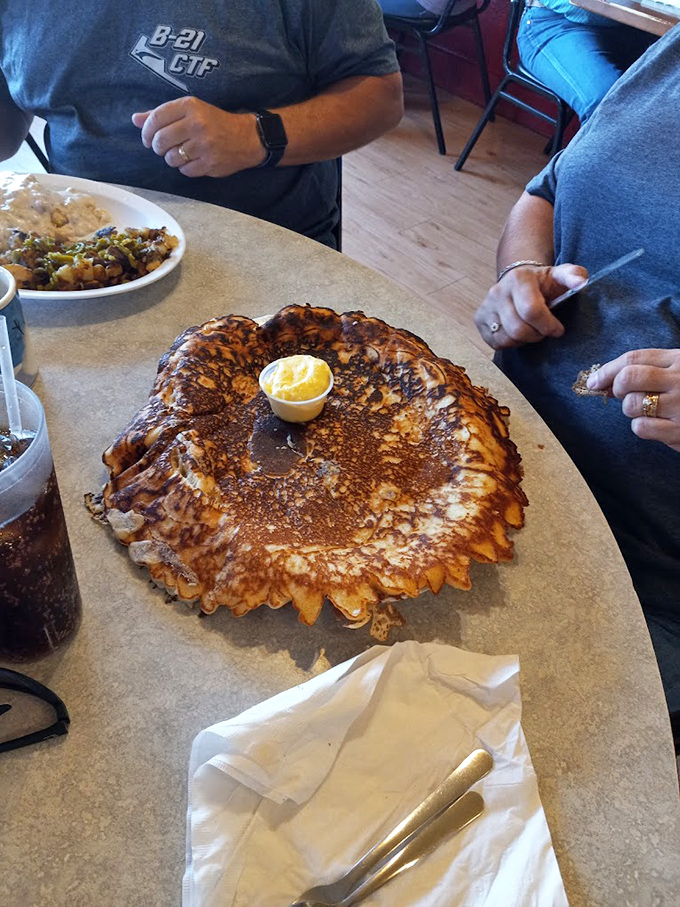 That pancake could double as a manhole cover – golden, massive, and begging for a butter avalanche.