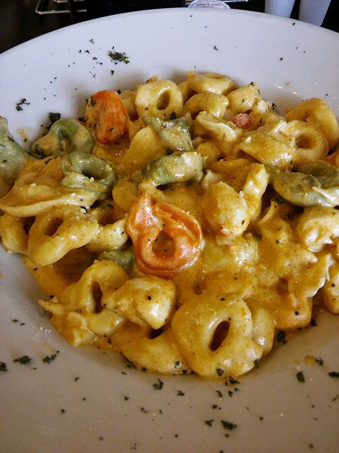 Tortellini swimming in a creamy sauce that's so good you'll contemplate drinking it directly from the bowl when nobody's looking.