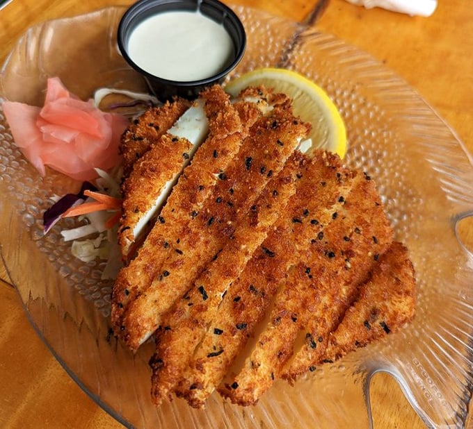 Calamari strips lined up like they're ready for their close-up, crispy and camera-ready indeed.