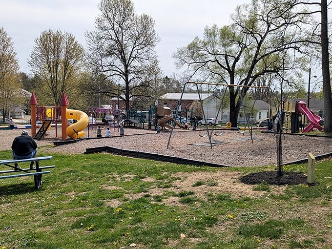 Community playgrounds with actual space to run around remind you that not every childhood memory needs to involve a tablet and Wi-Fi password.
