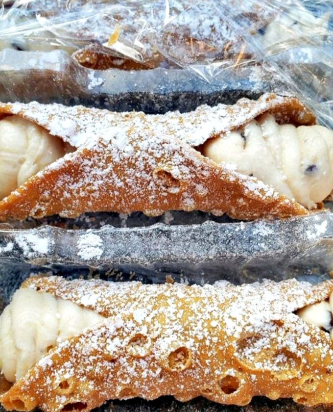 Cannoli so perfect they'd make a Sicilian grandmother weep with joy. Those crisp shells practically shatter with anticipation.