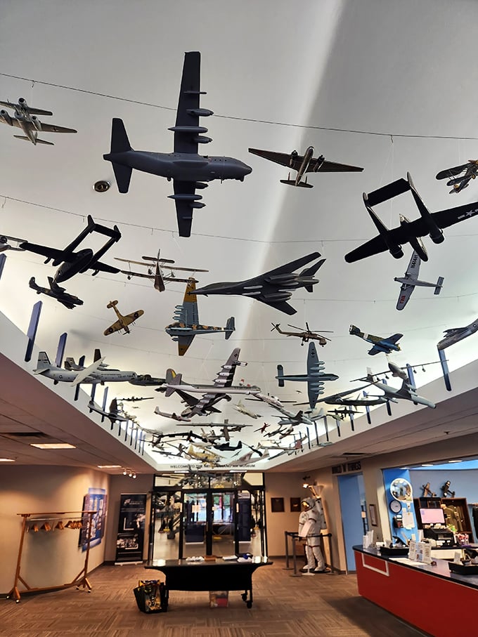 Look up! A constellation of model aircraft dangles from the ceiling like a mechanical mobile for aviation enthusiasts. Airplane spotting without the neck strain.