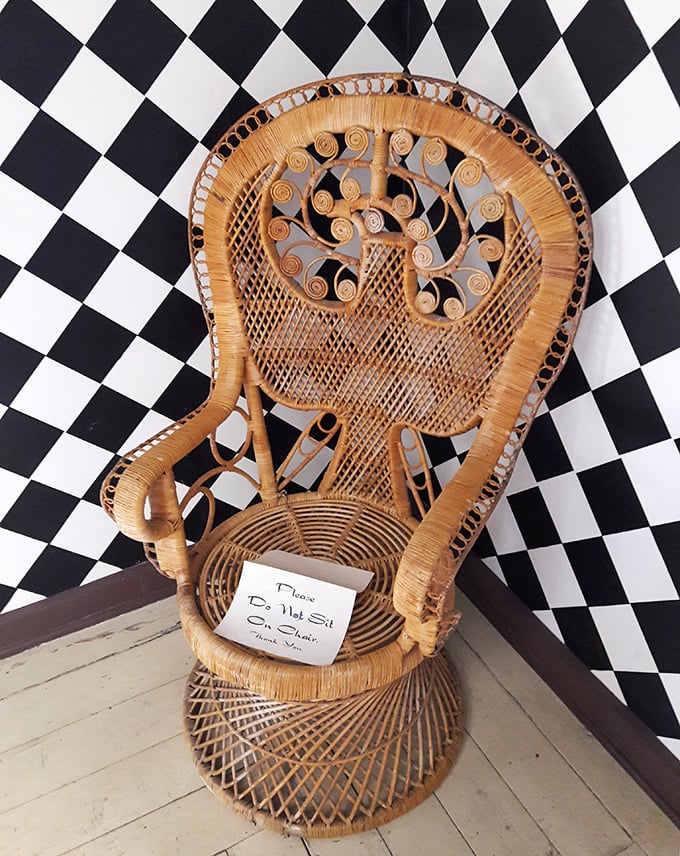 This peacock chair has seen things, heard stories, and absolutely refuses to sit in anyone's boring living room.