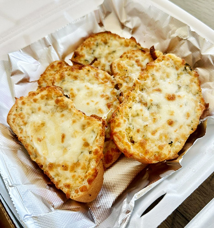 Cheese bread that makes French toast jealous. These golden slices showcase Orsi's talent for transforming simple ingredients into something worth driving across state lines for.