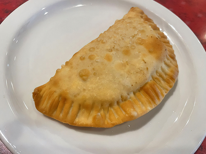This empanada isn't just a pastry&mdash;it's a golden half-moon of happiness with a perfectly crimped edge. One bite and you'll be planning your next visit.