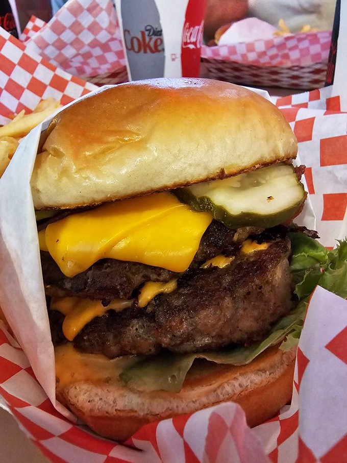 This isn't just a burger&mdash;it's architecture. Towering layers of beef, cheese, and pickle create the skyscraper of satisfaction your stomach has been dreaming about.