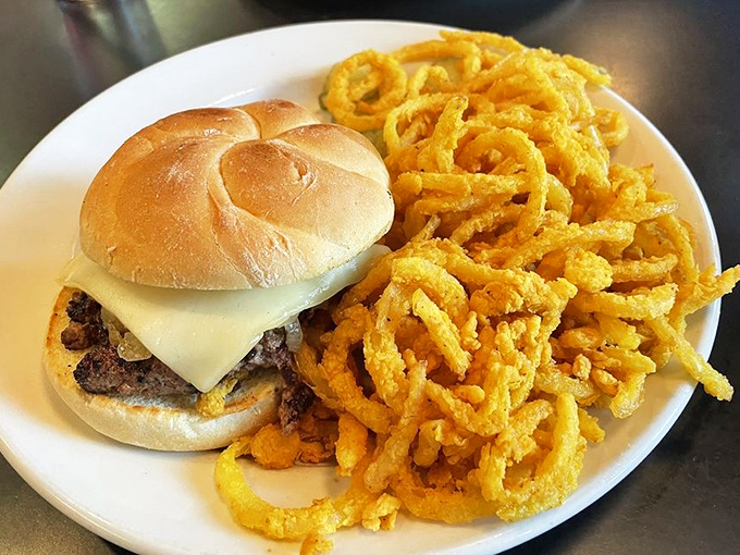 The cheeseburger and onion rings combo that makes you question why salads were ever invented. Crispy, juicy, perfect.