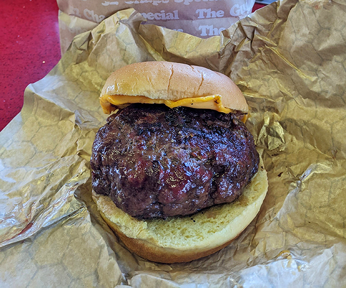 Not just any burger &ndash; a charred, juicy masterpiece with cheese melting into every crevice. Napkins required, regrets impossible.