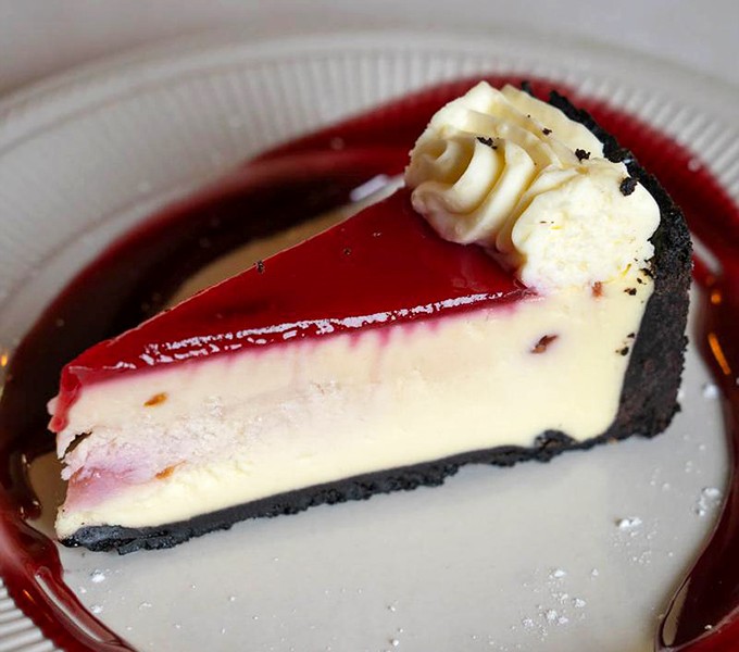 Cheesecake wearing a raspberry beret (the kind you find at a good Italian store)—creamy, rich, and unapologetically indulgent.
