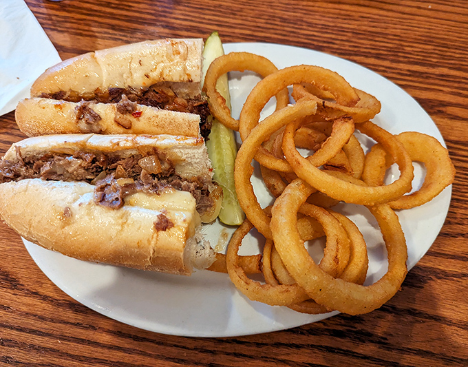 A proper Pennsylvania cheesesteak with onion rings that could double as edible bracelets. Simple food done right is never simple to forget.