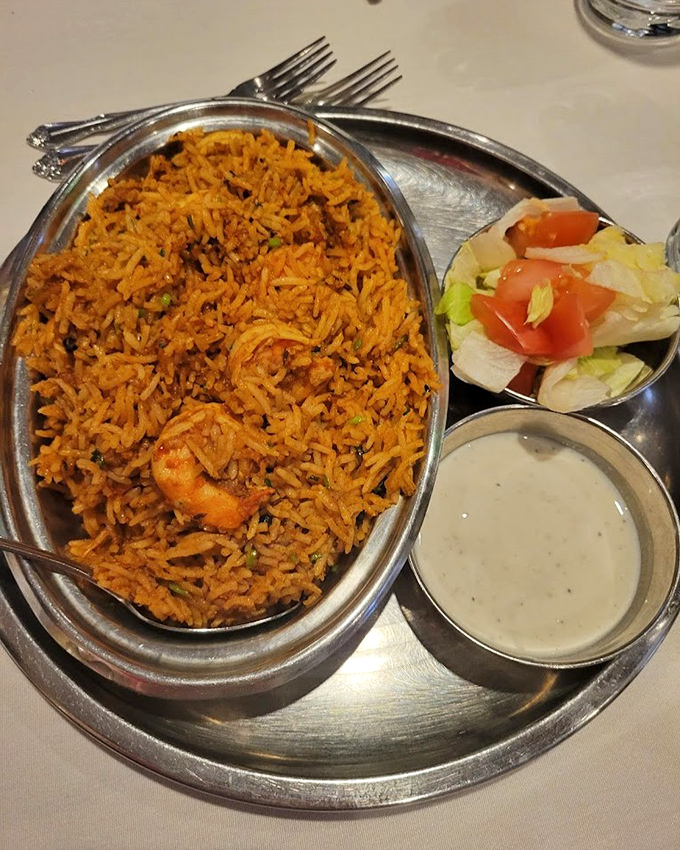 Biryani that speaks volumes&mdash;each grain of rice perfectly seasoned, with green peas adding pops of color like edible confetti at a flavor party.