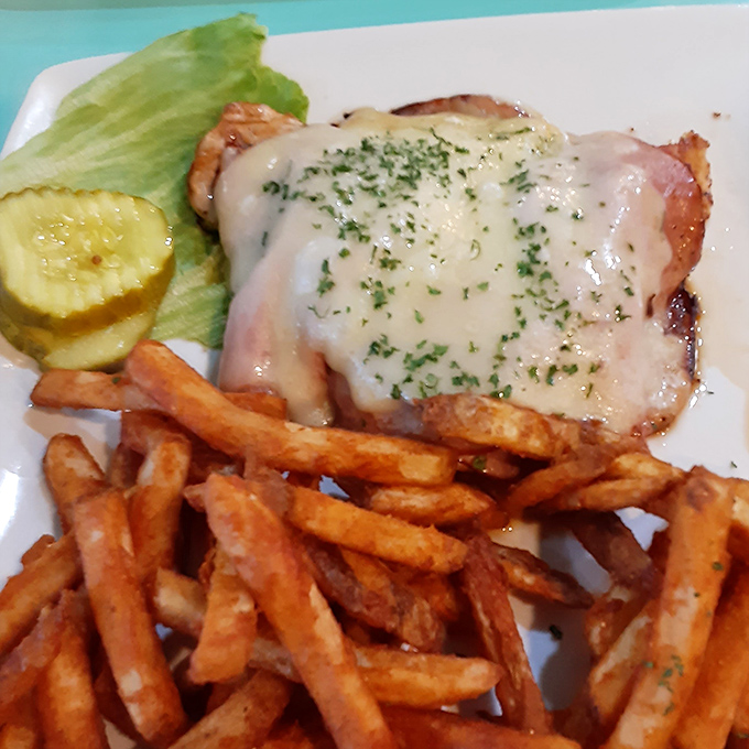 Not just chicken cordon bleu, but a masterclass in comfort &ndash; melty cheese blankets perfectly cooked chicken alongside crispy fries that demand attention.