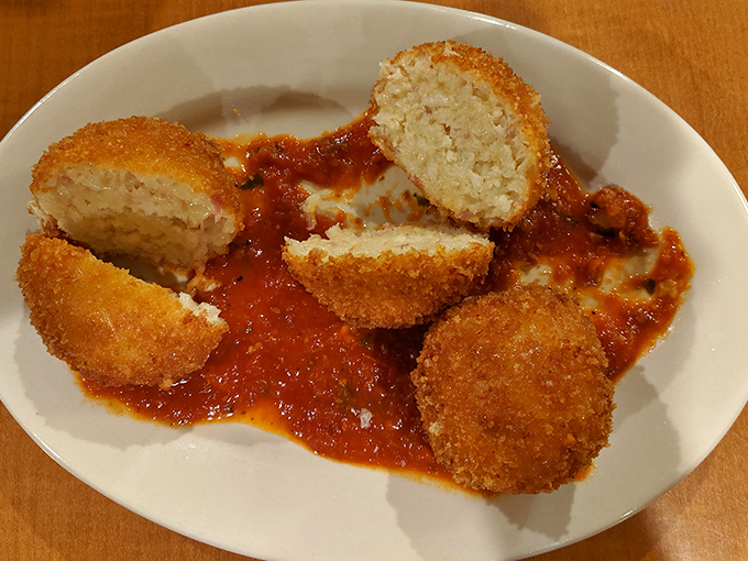 Golden-fried on the outside, cloud-soft within&mdash;these chicken croquettes swimming in marinara are what comfort food dreams are made of.