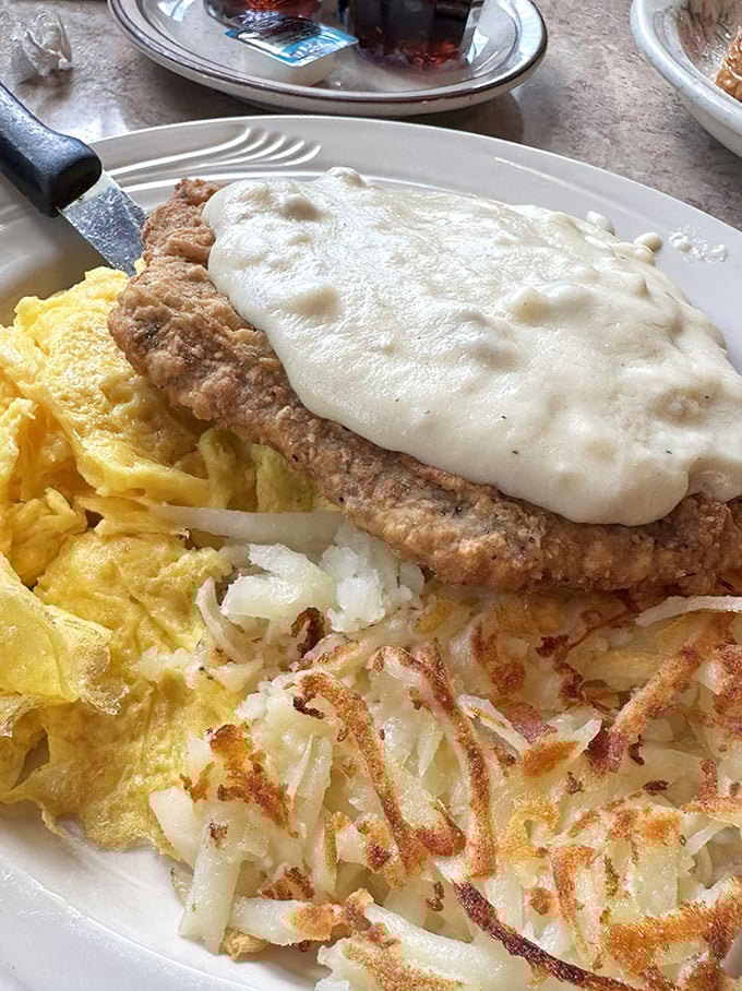 Chicken fried steak smothered in gravy so good you'll want to write it love letters, with eggs and hash browns playing perfect supporting roles.