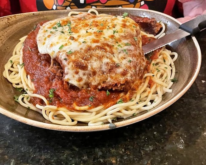 Chicken Parmesan that would make any Italian grandmother nod in approval. That golden cheese pull is the stuff of pasta dreams.